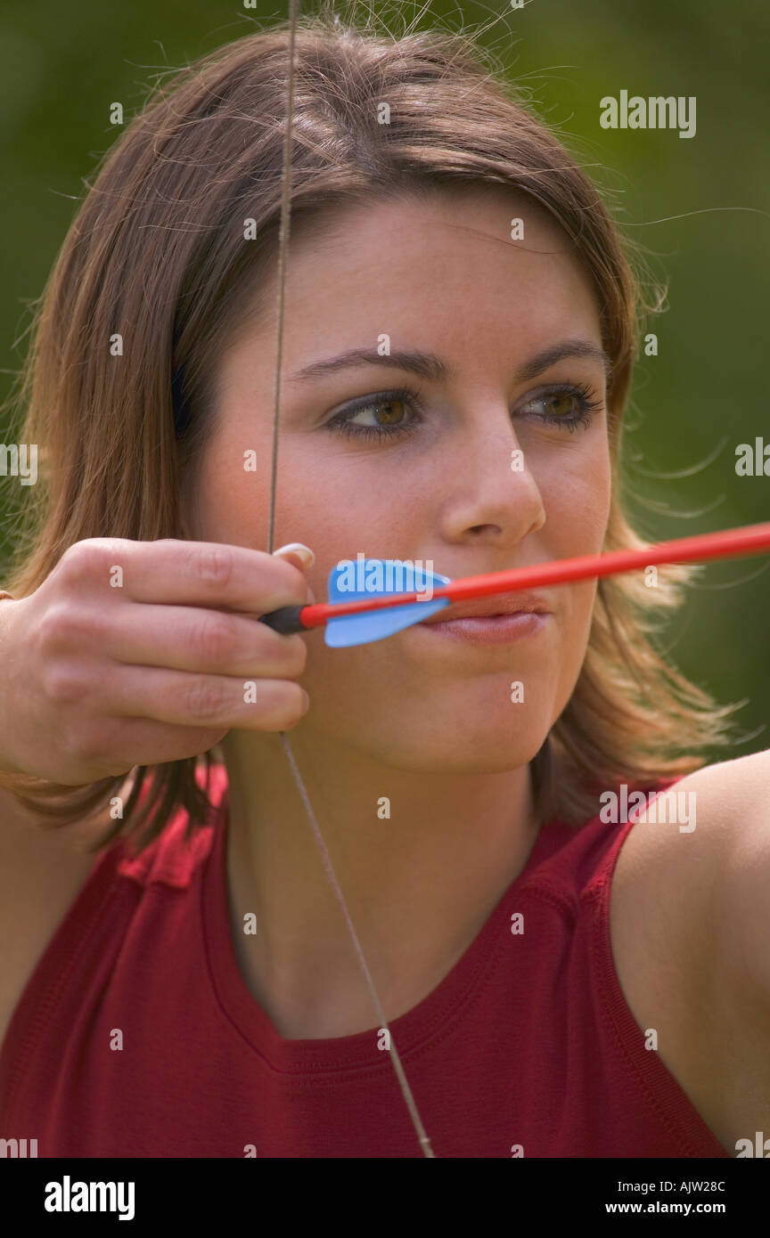 Woman with bow and arrow Stock Photo - Alamy