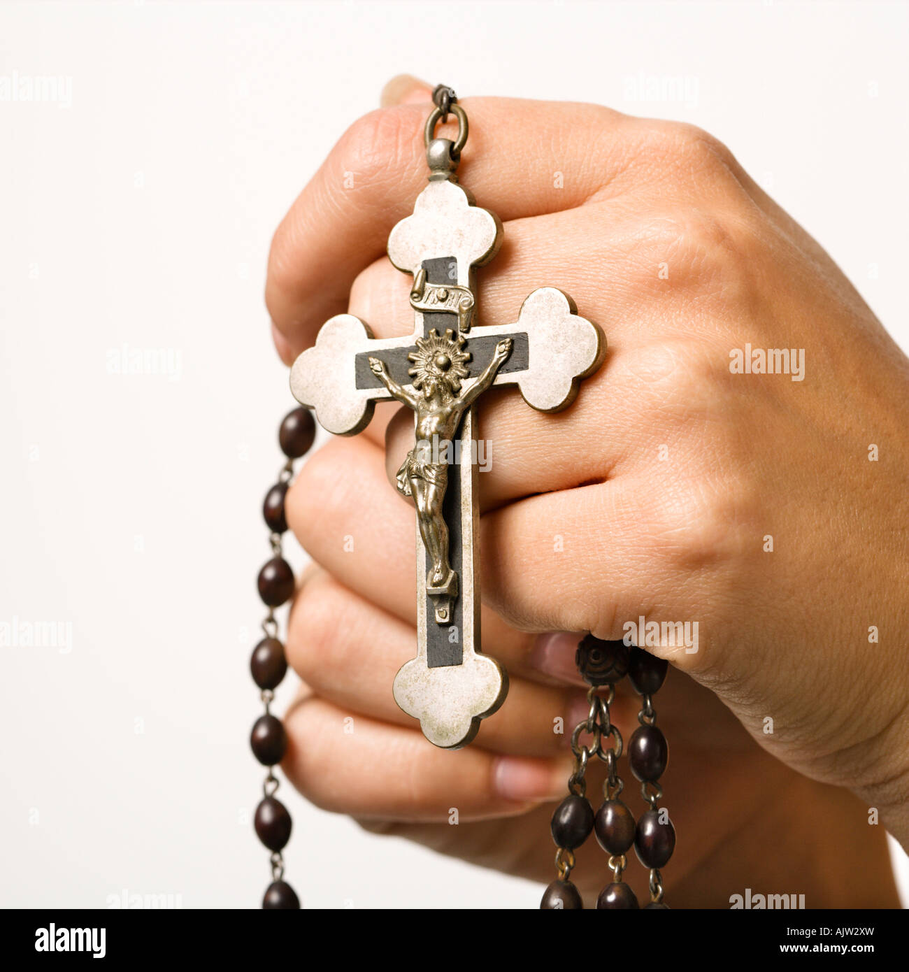 Woman s hands holding rosary with crucifix Stock Photo - Alamy