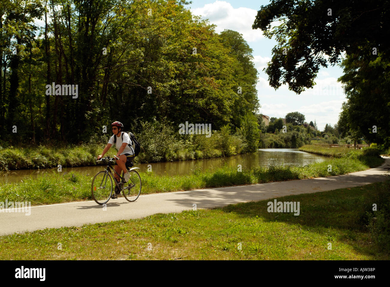 Cycling in France Bike Rider on Towpath of the Canal du Centre in ...