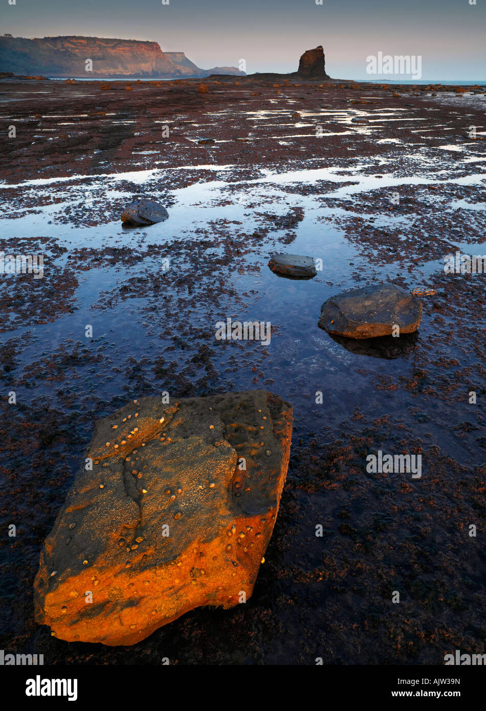 Black Knab and rocks at sunrise Saltwick Bay Stock Photo - Alamy