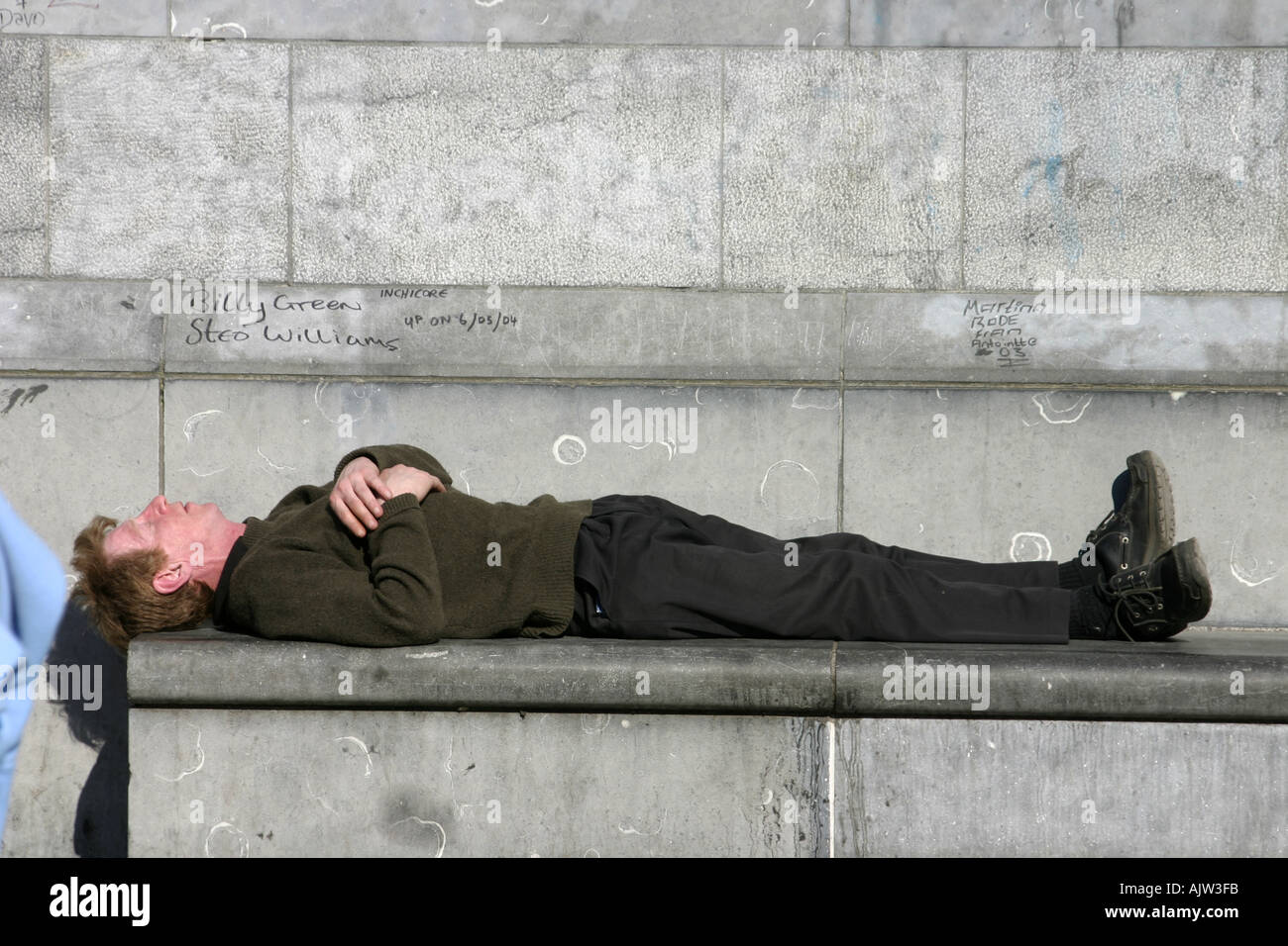 Man sleeping on a bench Dublin Ireland Stock Photo - Alamy