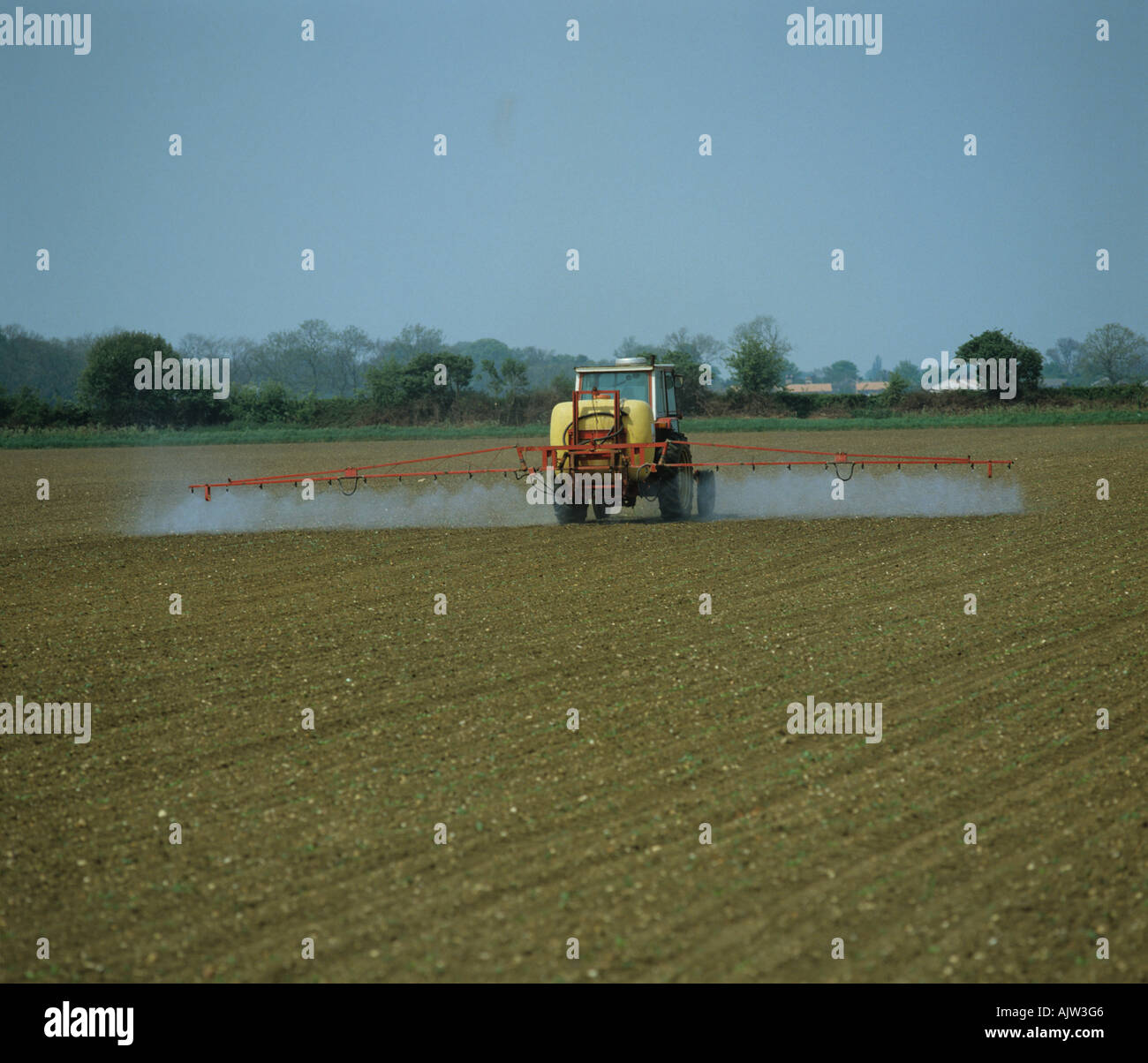 Old tractor mounted boom sprayer spraying early post emergence sugar ...