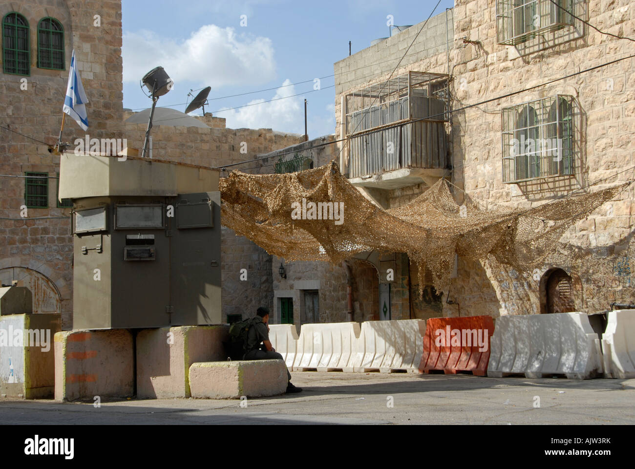 An Israeli military watchtower in Al-Sahla street separating ...