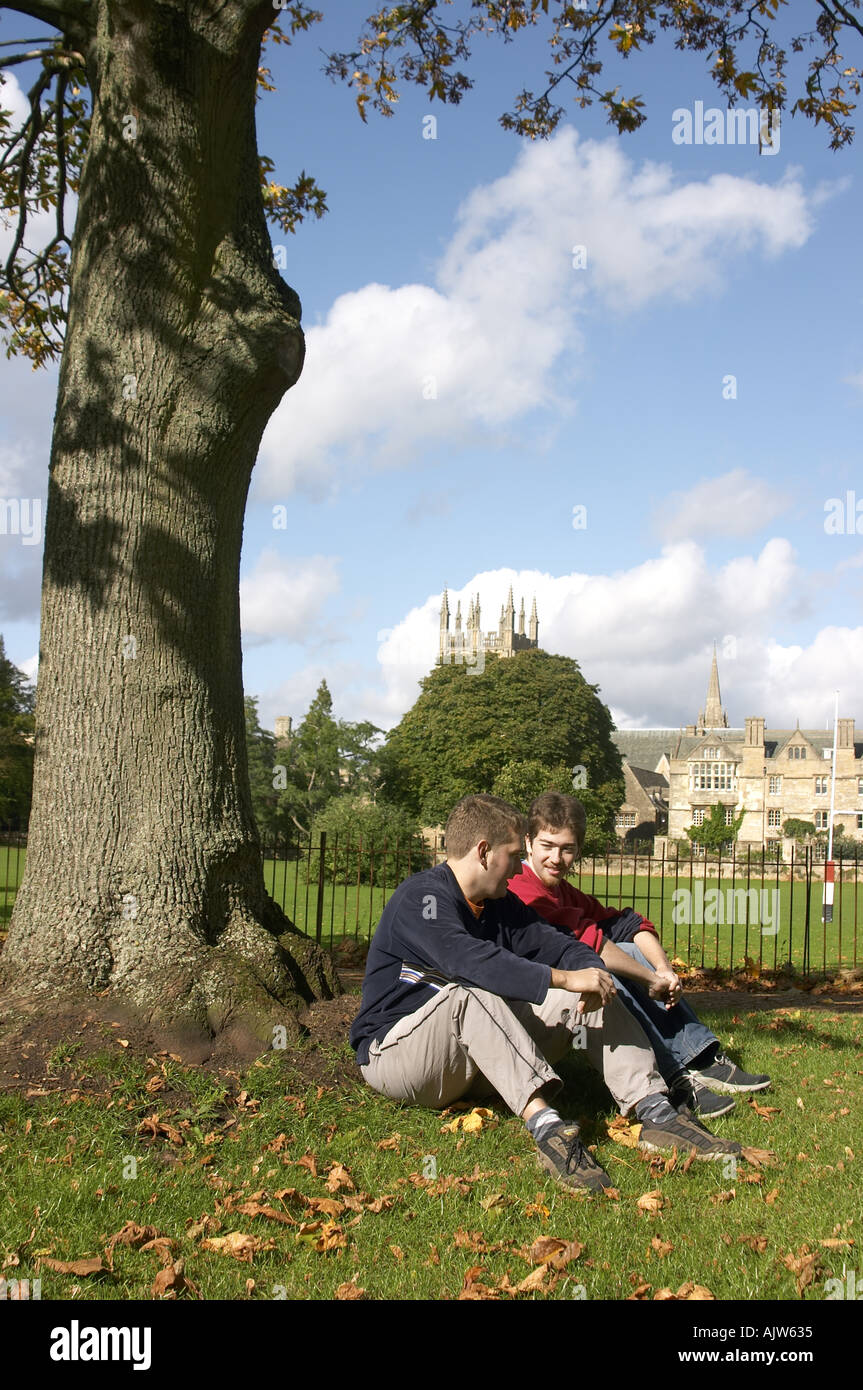 Two men sitting under tree hi-res stock photography and images - Alamy