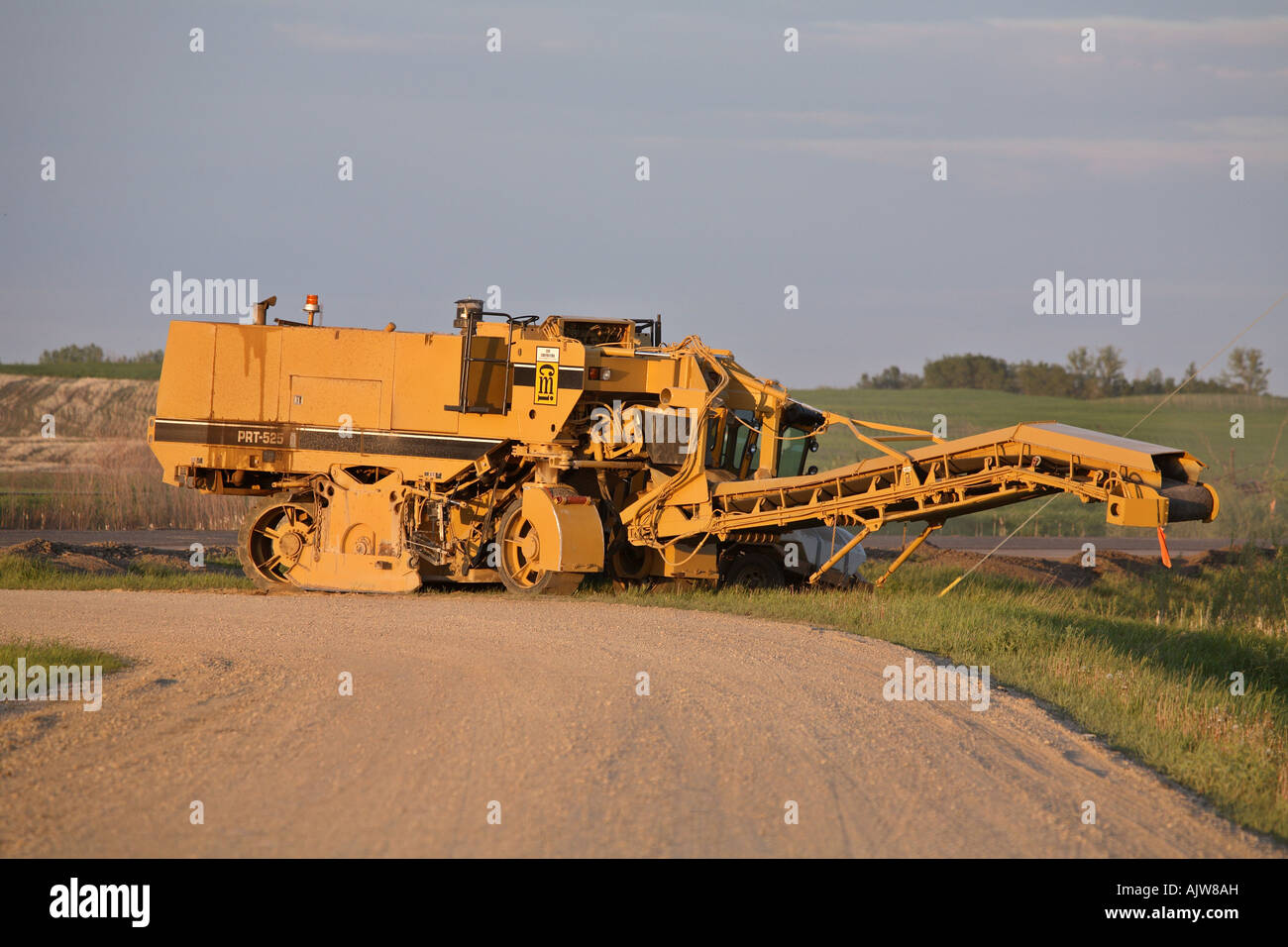 Road repair machine beside a country road Stock Photo - Alamy