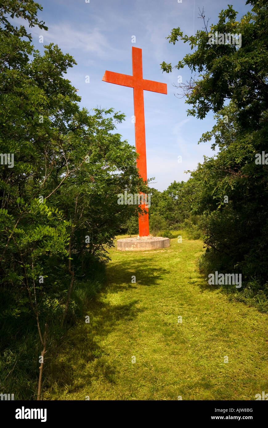 Giant red concrete cross set in the woods on the road to Pula in ...