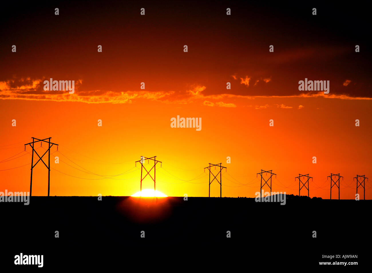 Sun setting behind Saskatchewan Hydro power lines Stock Photo - Alamy