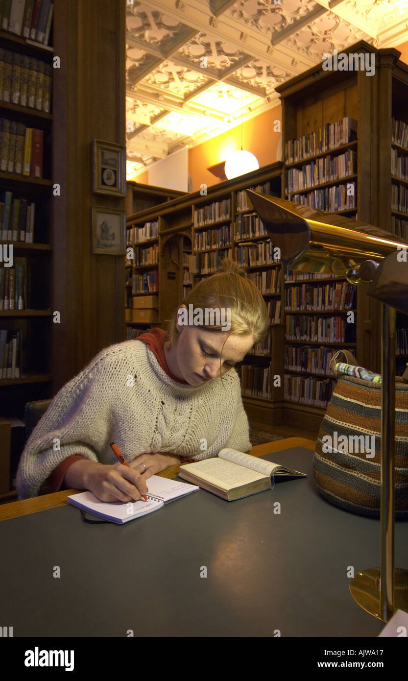 Female student studying in King s College Library Cambridge England ...