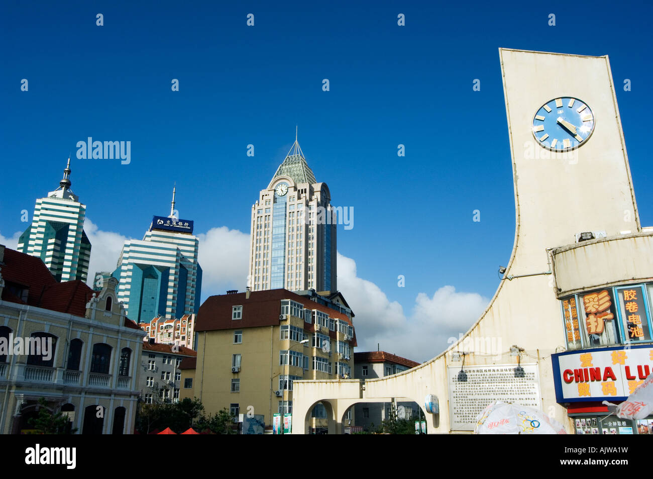 clock tower and modern skyscrapers Qingdao host of the sailing events ...