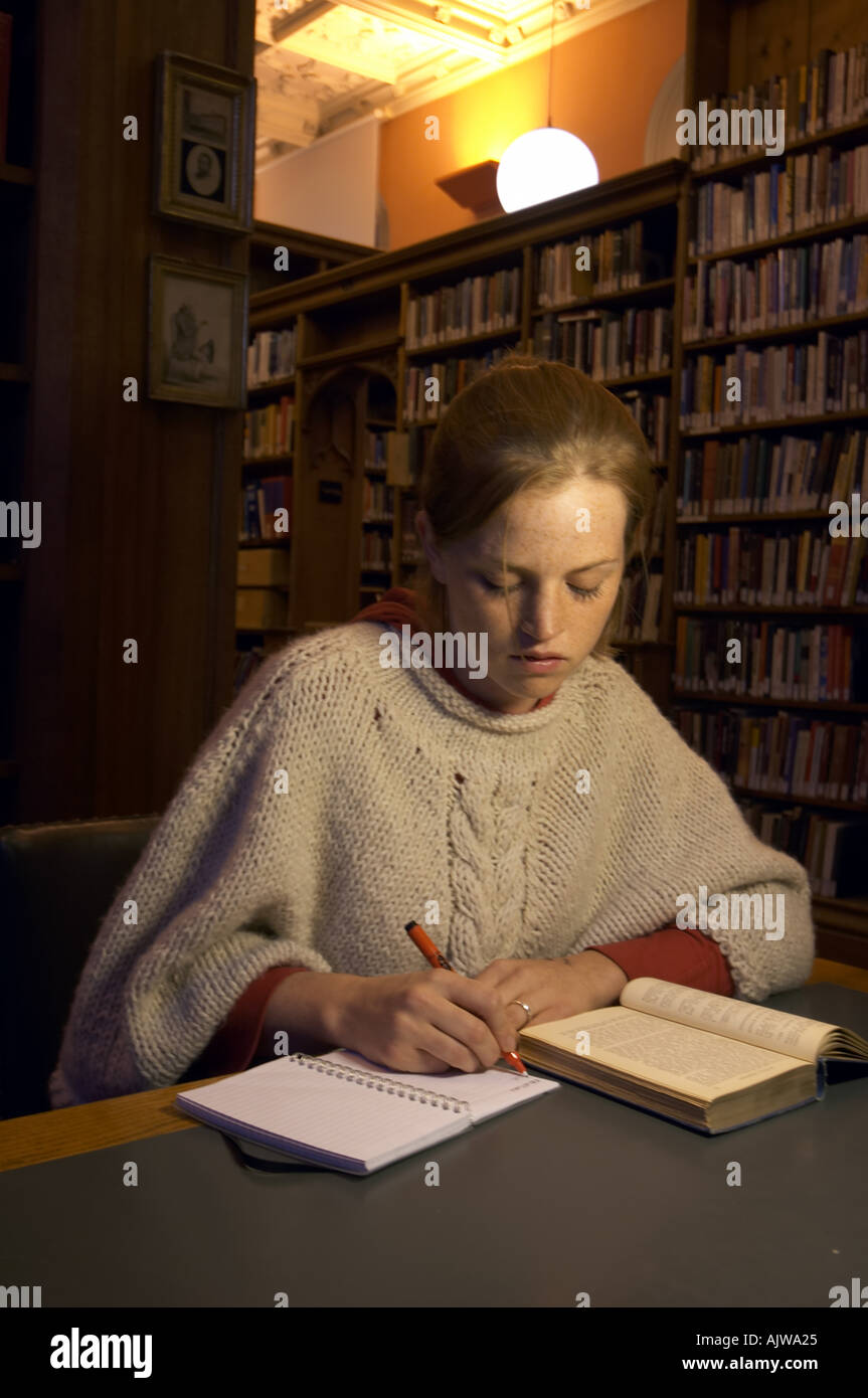 Female student studying in King s College Library Cambridge England ...