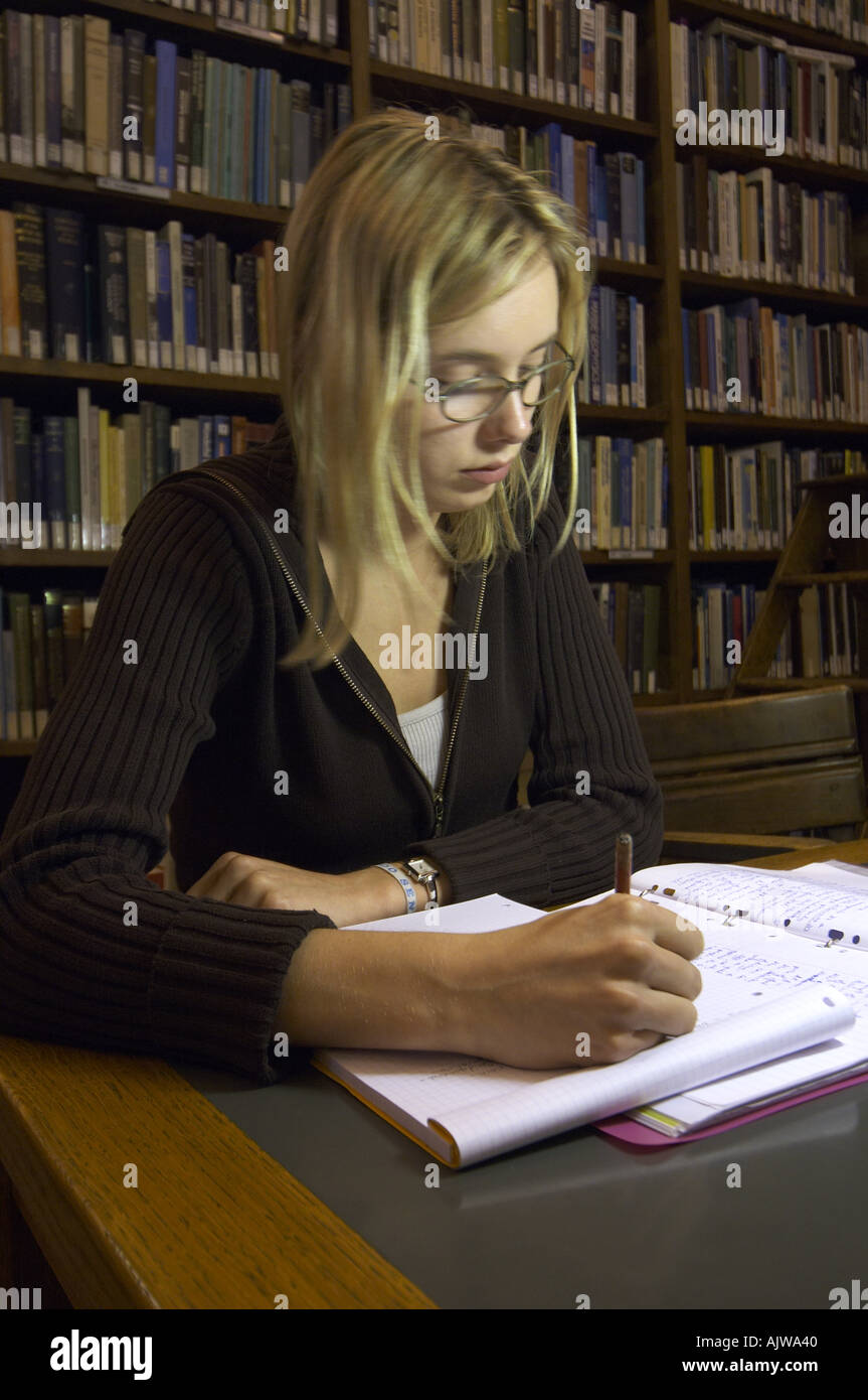Female student studying in King s College Library Cambridge England ...