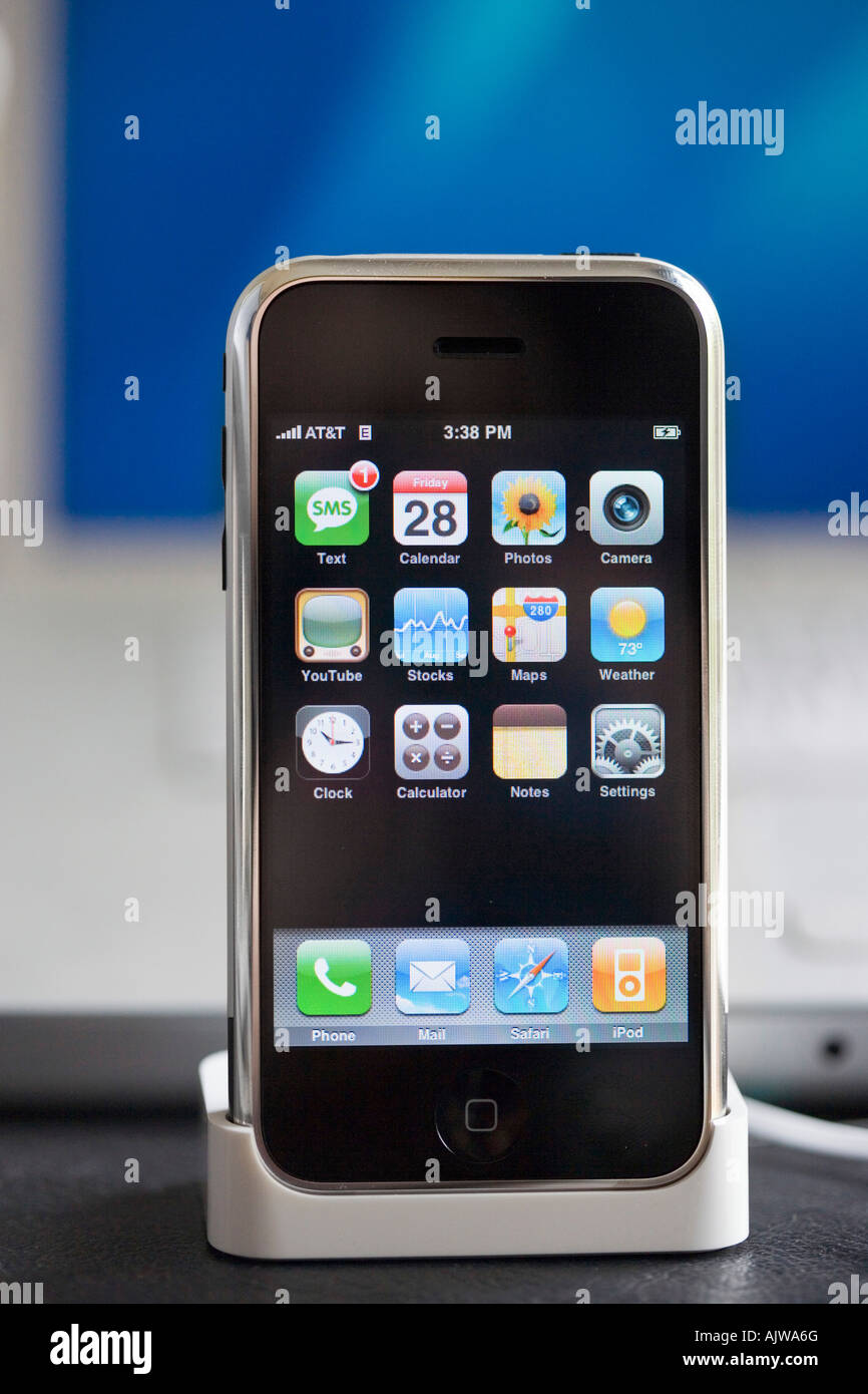 Apple iphone in front of Mac Book Pro laptop showing iphone menu Stock ...