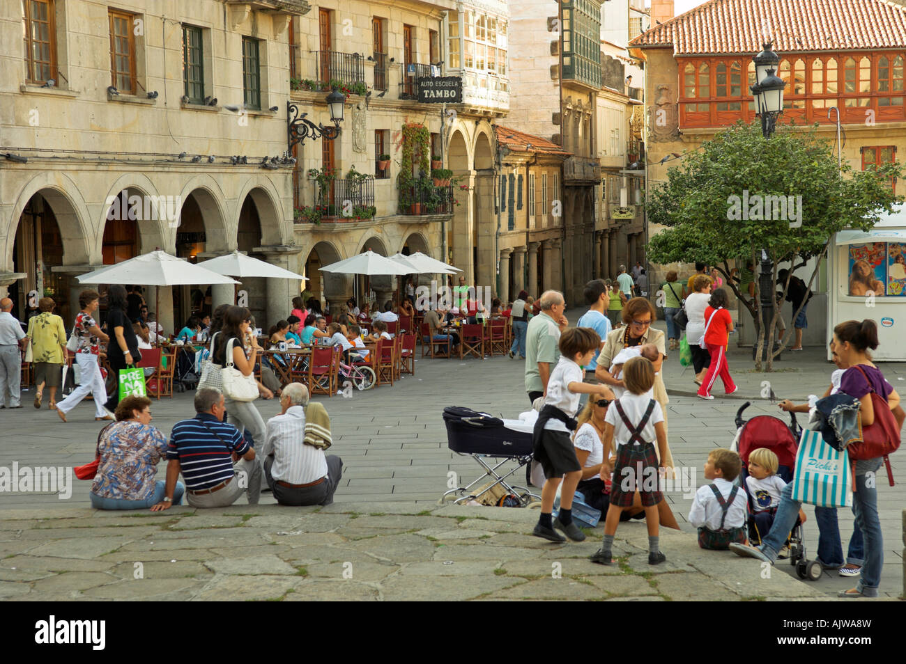 People and families socializing in praza da Ferreria old town ...