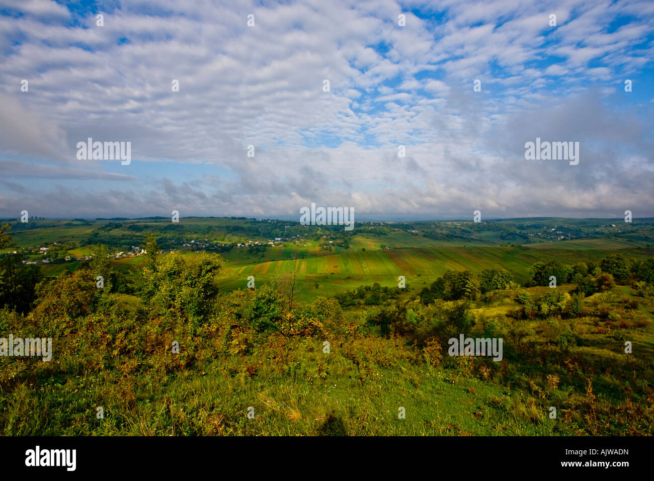 A wide open horizon line stretches before us while the sun paints the ...
