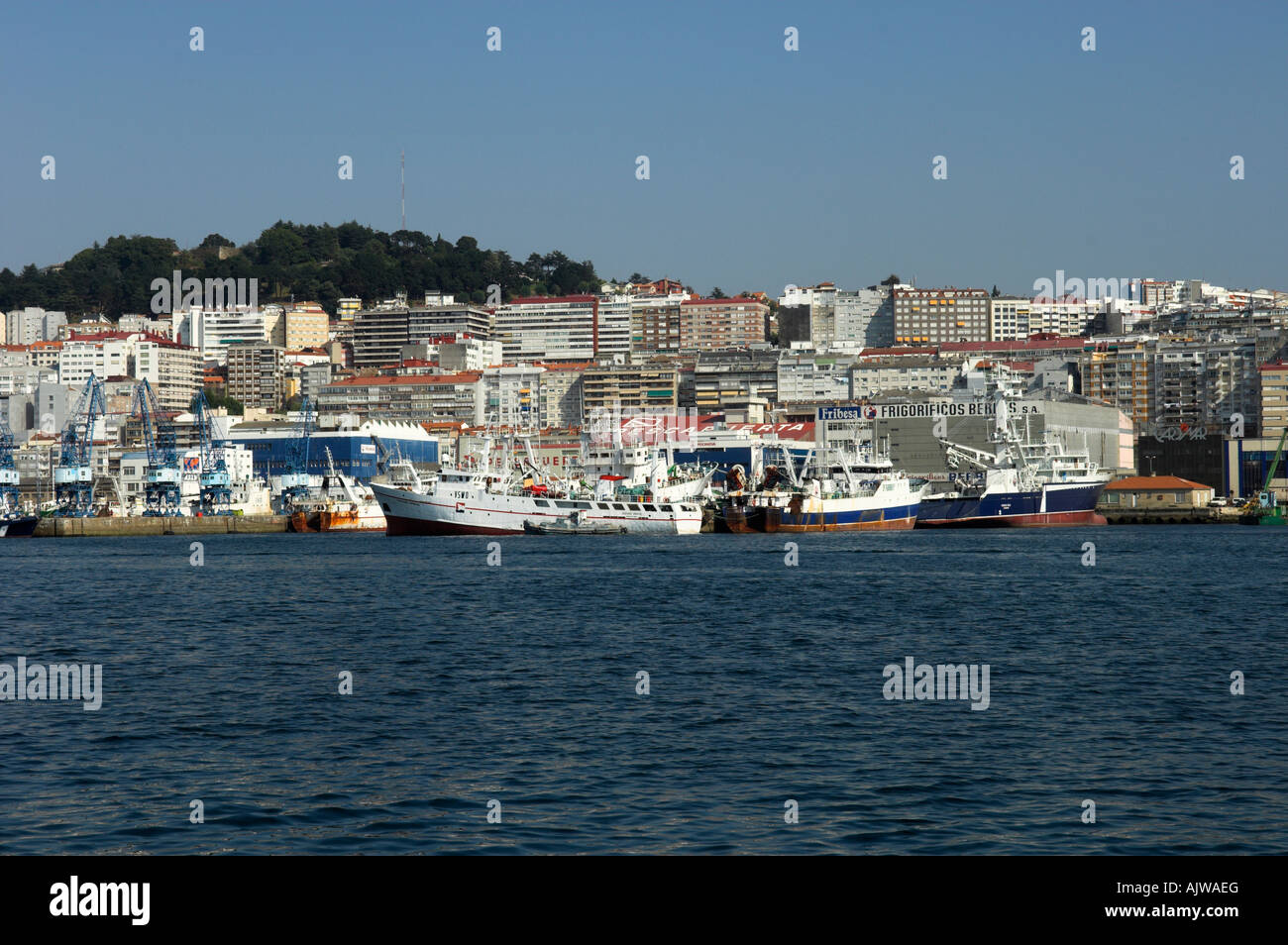 Skyline of Vigo harbour with fishing boats in for refurbishment Galicia ...