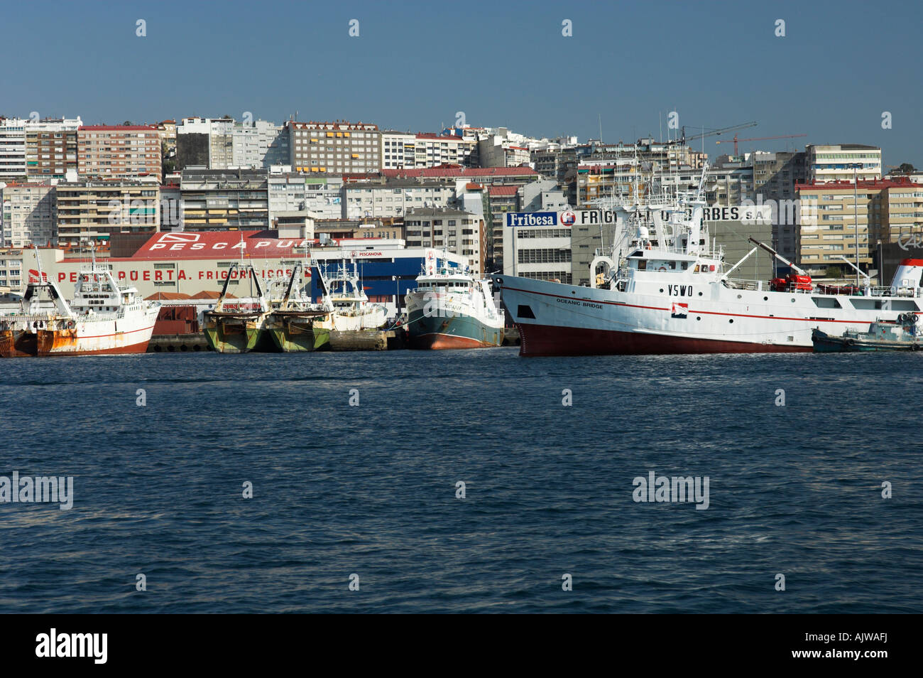 Skyline of Vigo harbour with fishing boats in for refurbishment Galicia ...