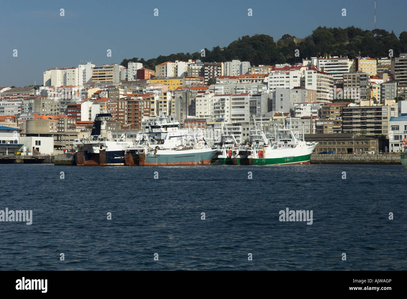 Skyline of Vigo harbour with fishing boats in for refurbishment Galicia ...