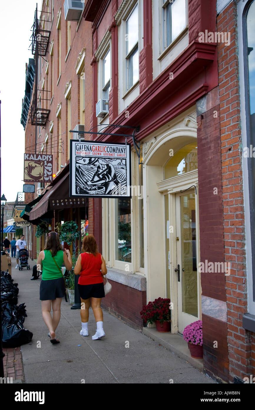 People strolling down the sidewalk of Galena illinois Main street past ...