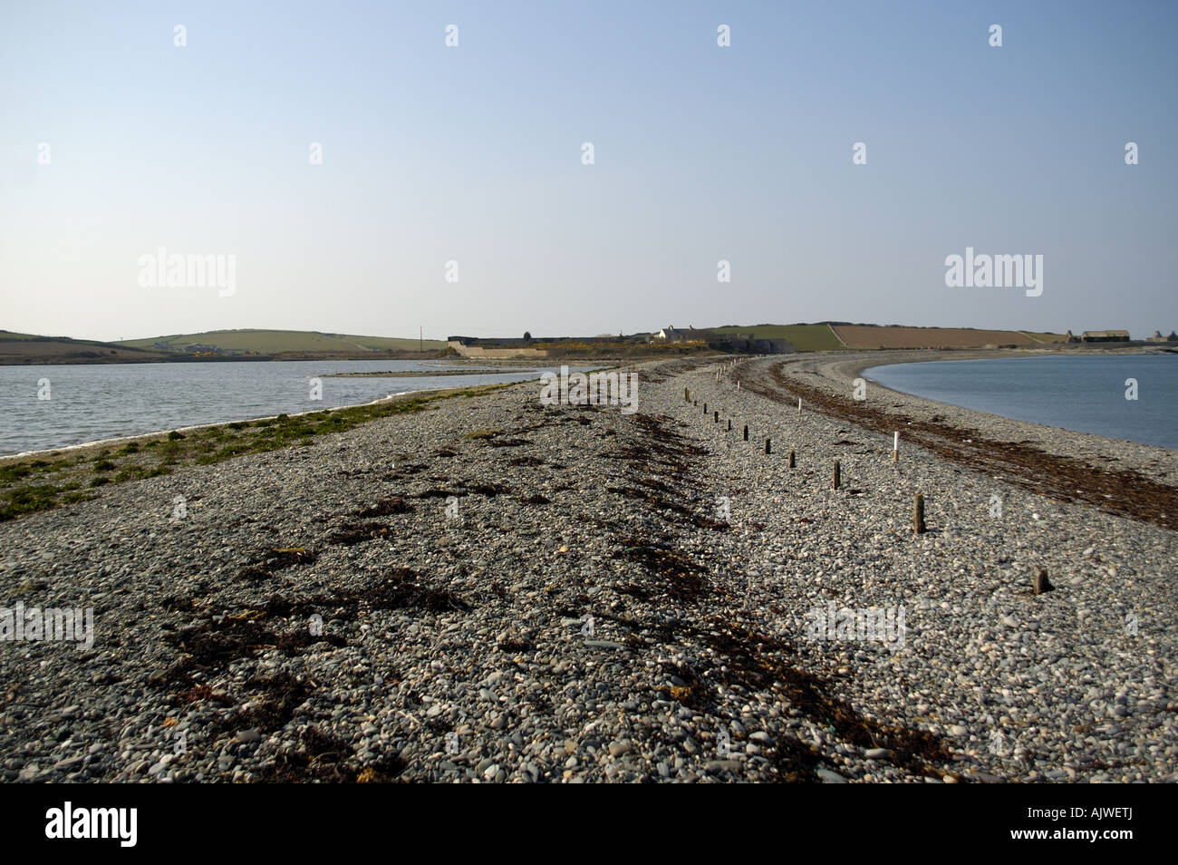 Shingle beach and brackish lagoon at Cemlyn Bay Anglesey North Wales ...