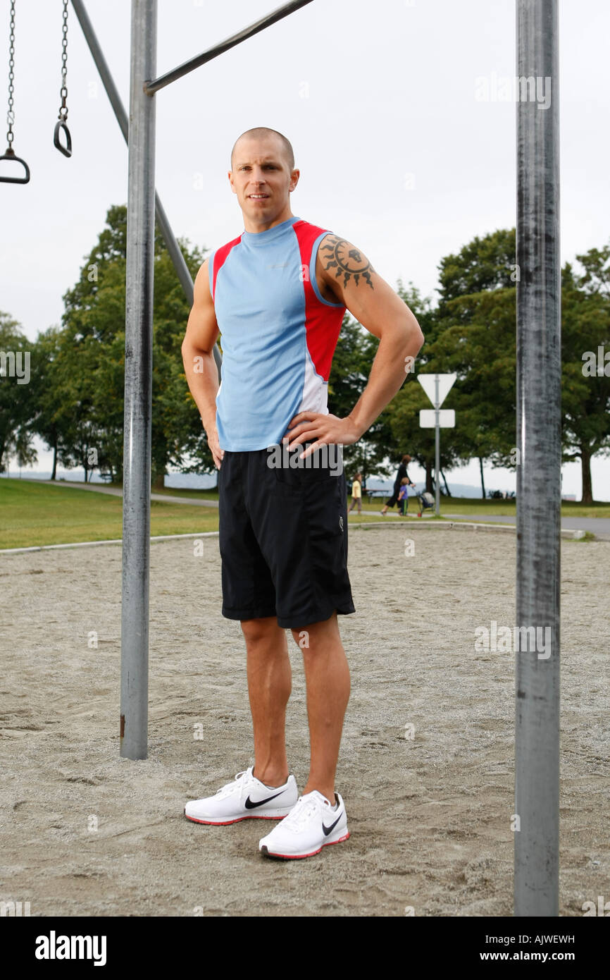 fit muscular hard body male personal trainer exercising outdoors Stock ...