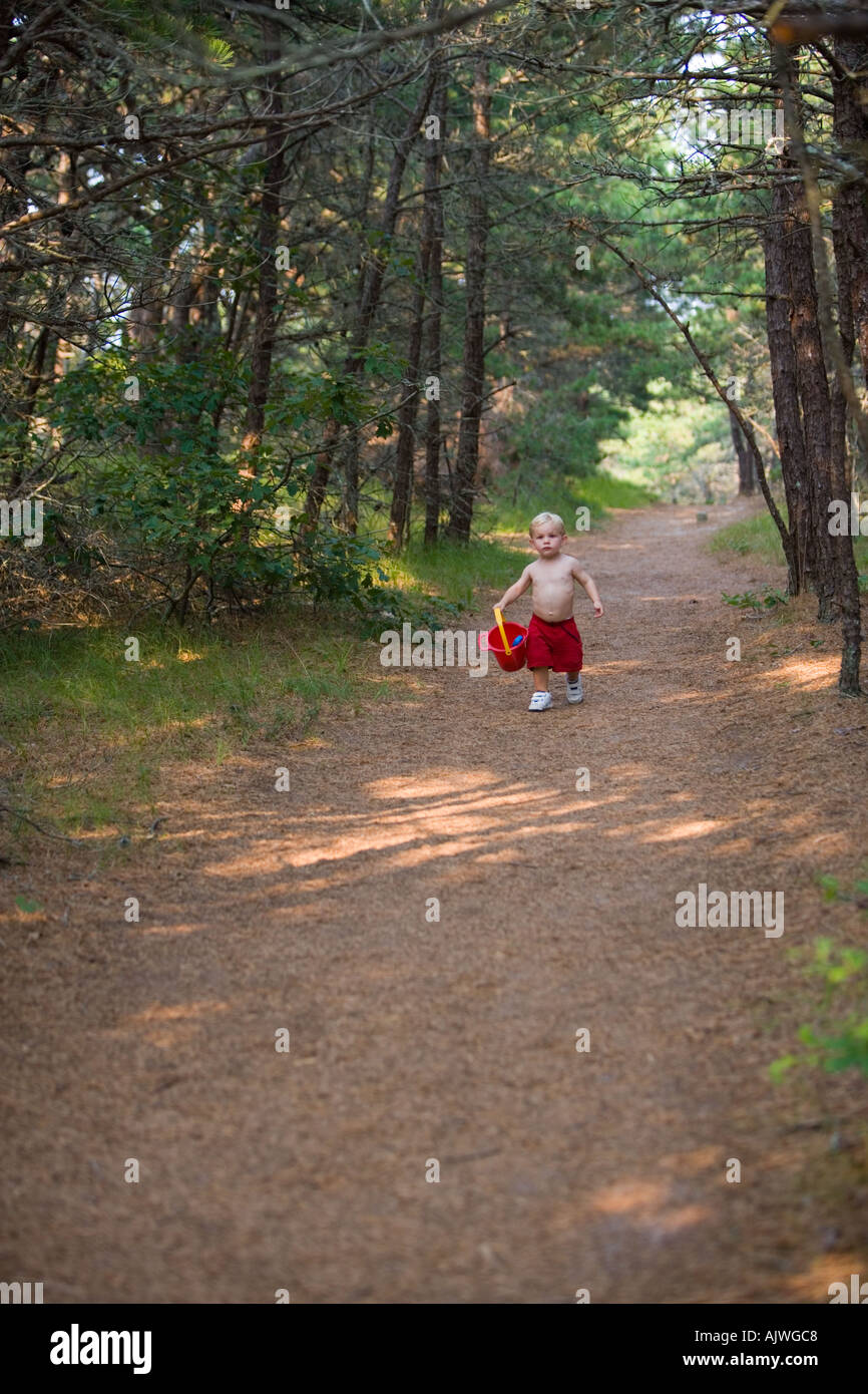 A young boy age2 heads to the beach at the Cape Cod National Seashore ...