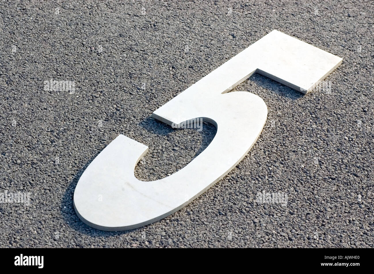 number five on road surface Stock Photo - Alamy