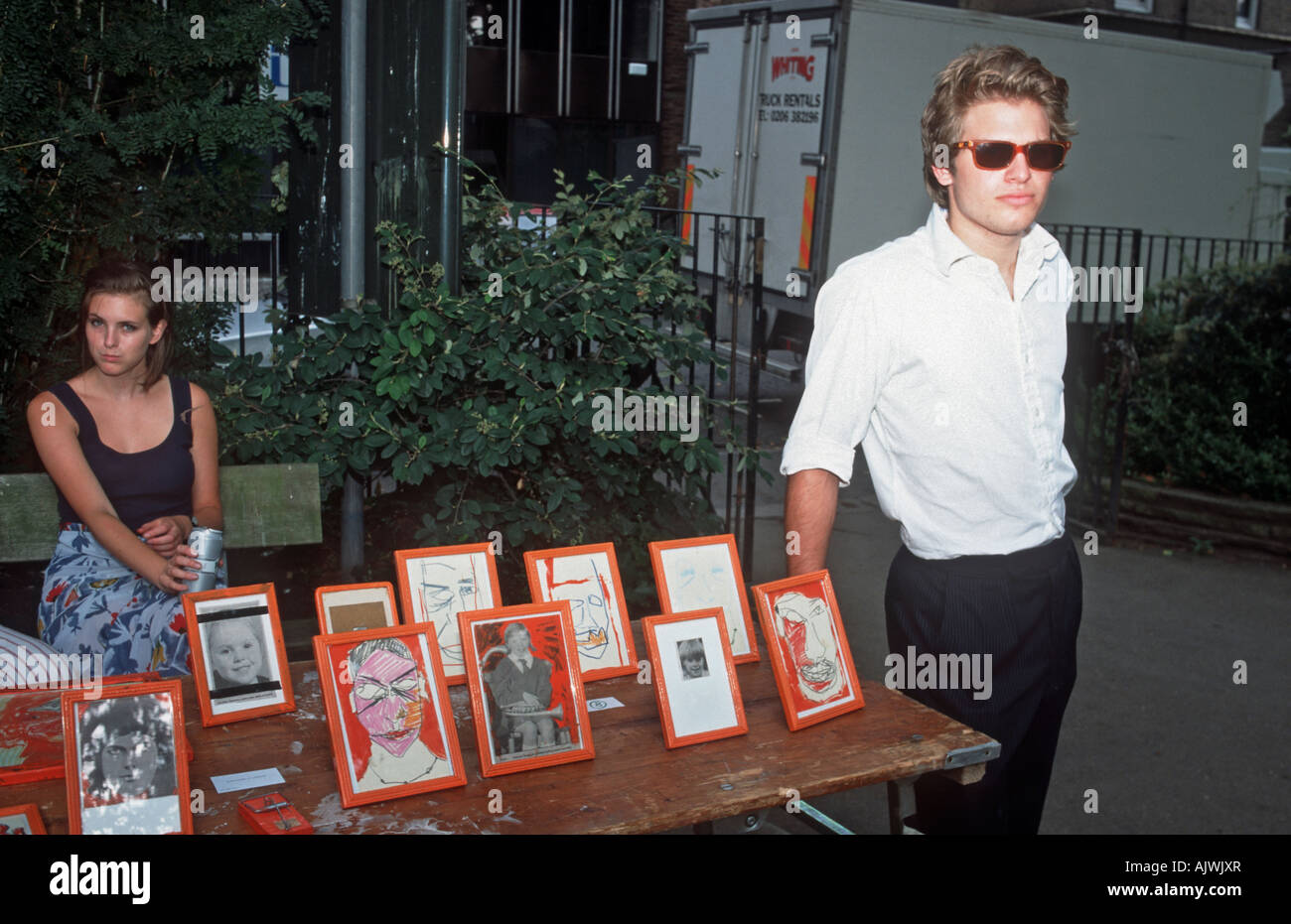 Alexander de Cadanet standing next to a stall selling his work at ...