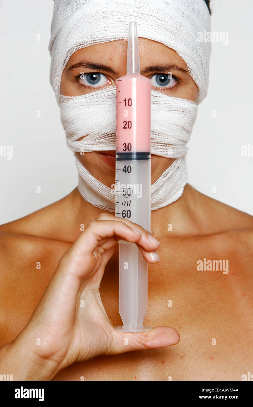 woman with white head dressing and a pink injection Stock Photo - Alamy