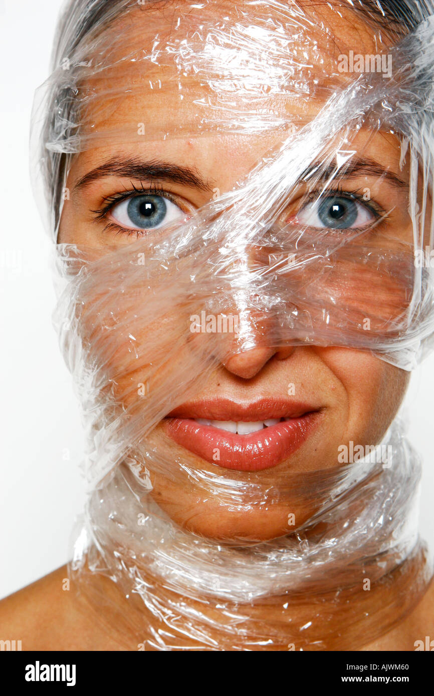 woman with cling film wrapped around her head and face Stock Photo - Alamy