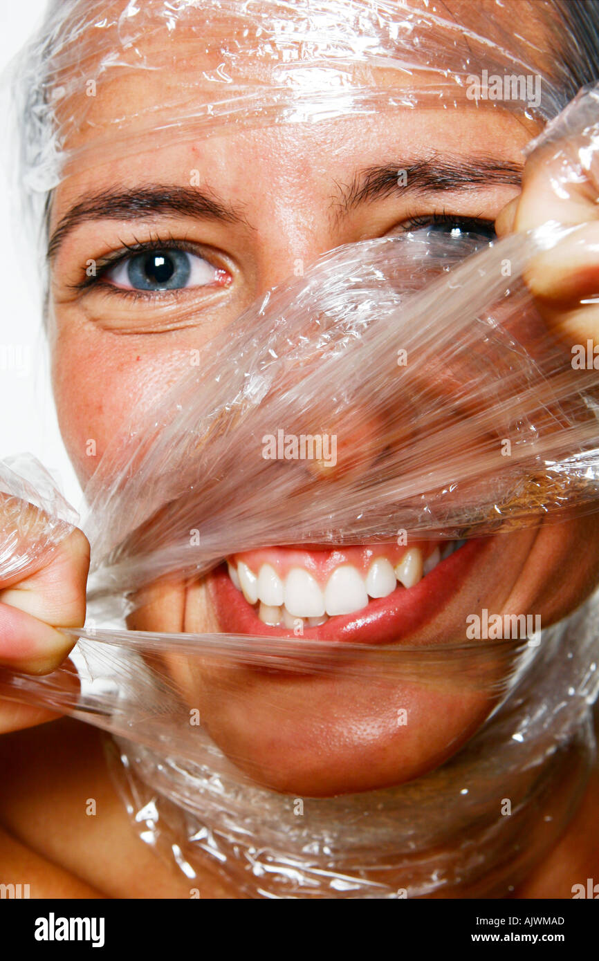 woman with cling film wrapped around her head Stock Photo - Alamy