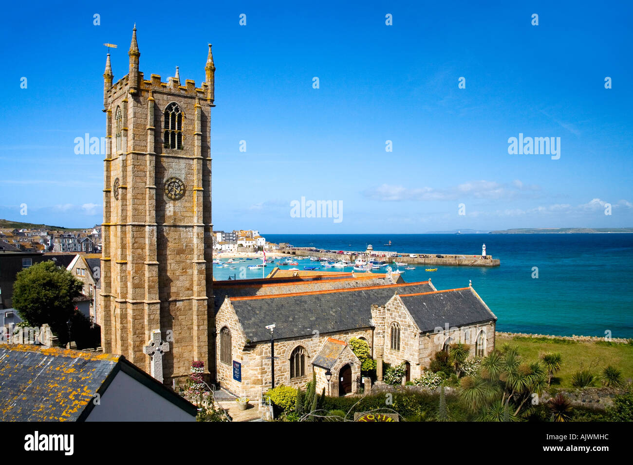 St Ives Parish church and view over the harbour and sea on sunny ...
