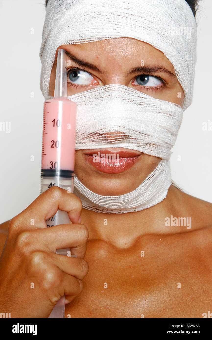 woman with white head dressing and a pink injection Stock Photo - Alamy