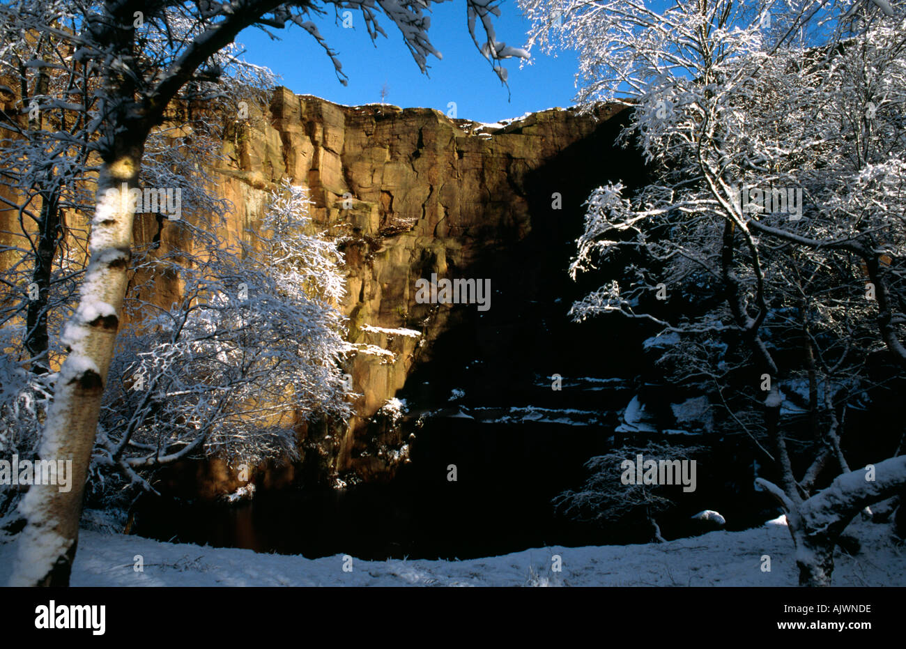 Snow and blue sky at climers Lawrencefield quarry Derbyshire Peak ...