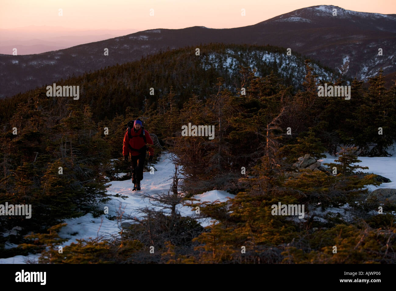 A backpacker at sunset on Mt Bond in New Hampshire s White Mountains ...