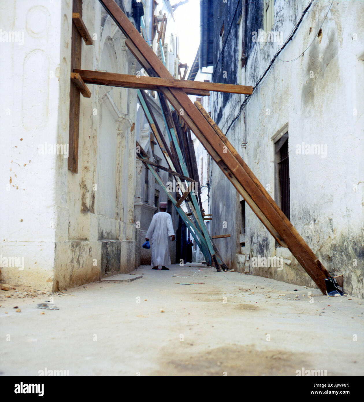 Man walking through Stone Town Stock Photo - Alamy