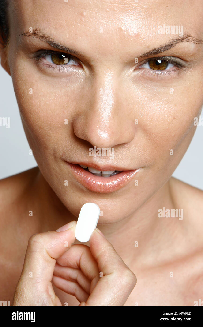 Woman beauty supplements tablets hi-res stock photography and images ...