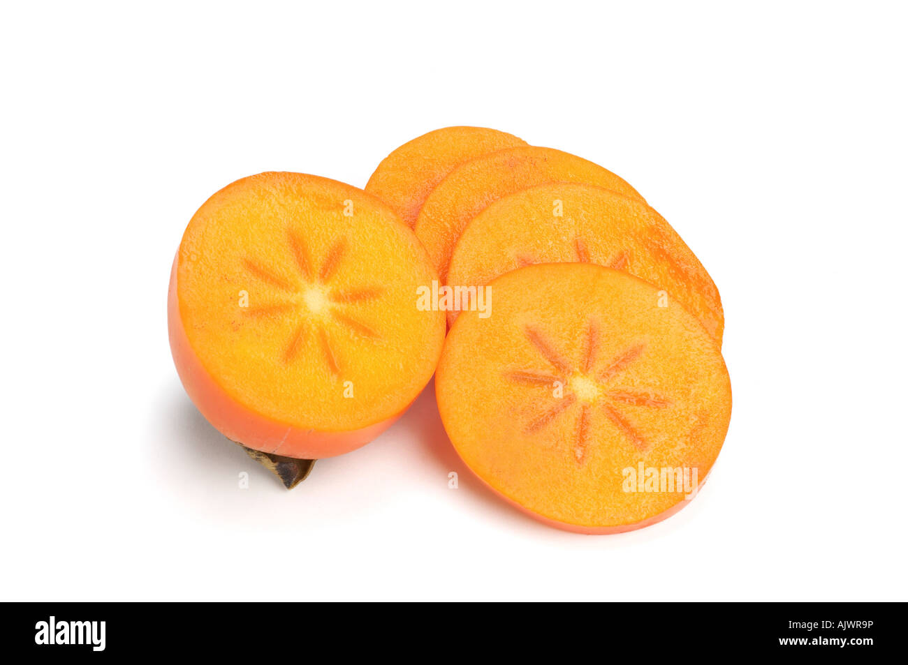 Persimmon or Sharon Fruit sliced Stock Photo - Alamy