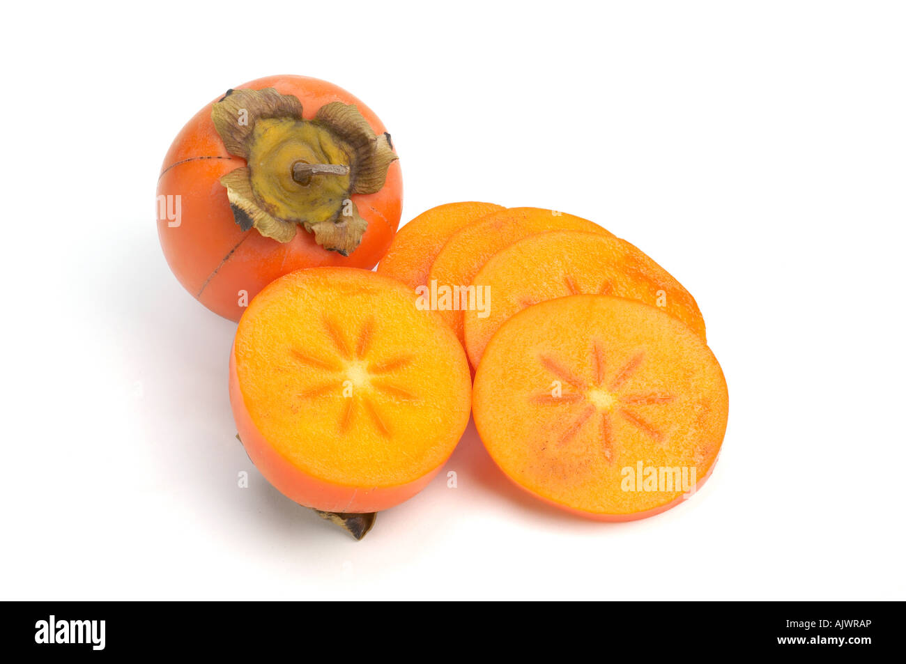 Persimmon or Sharon Fruit sliced Stock Photo - Alamy