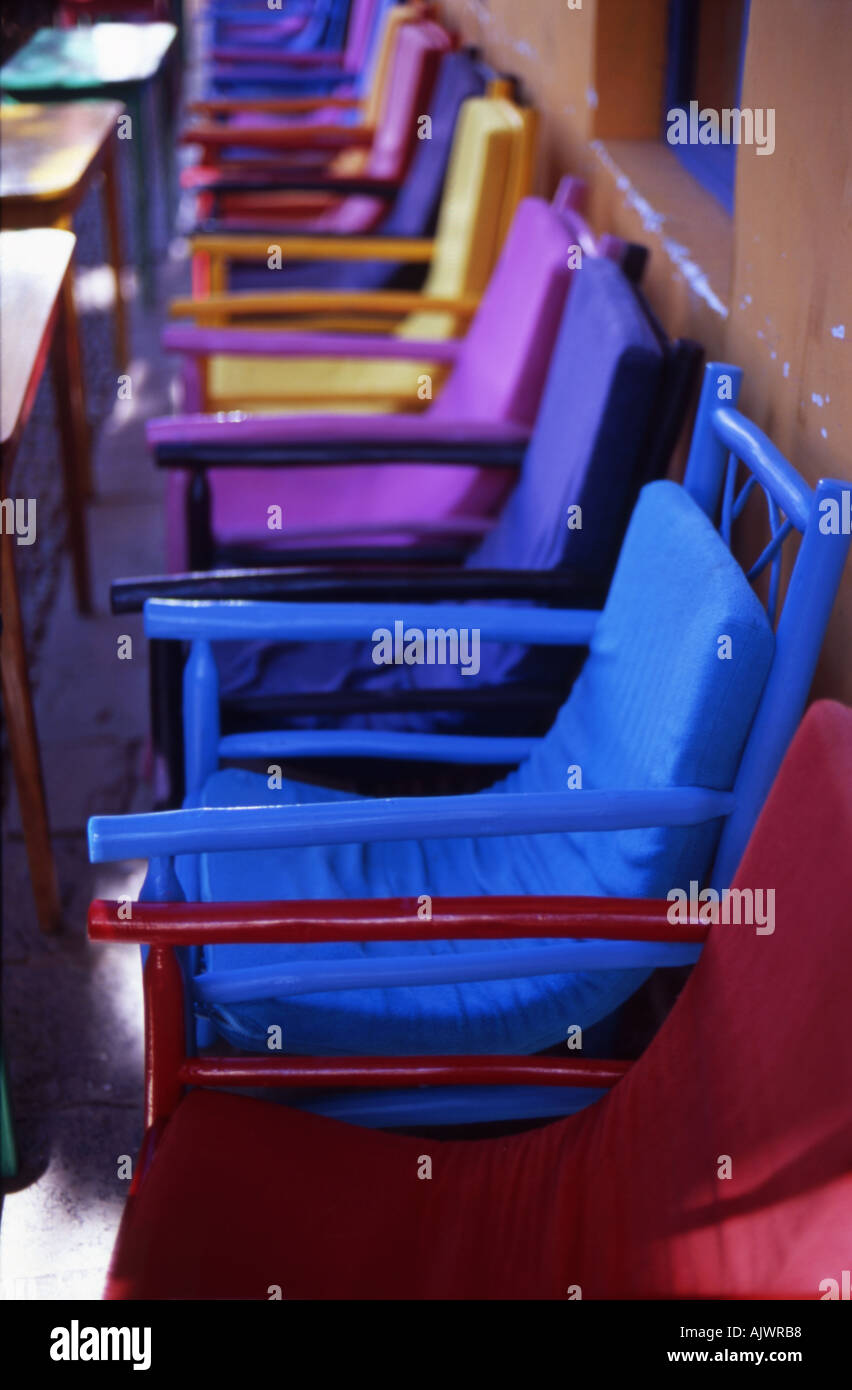 Multi coloured chairs and tables shallow depth of field Pisac Peru ...