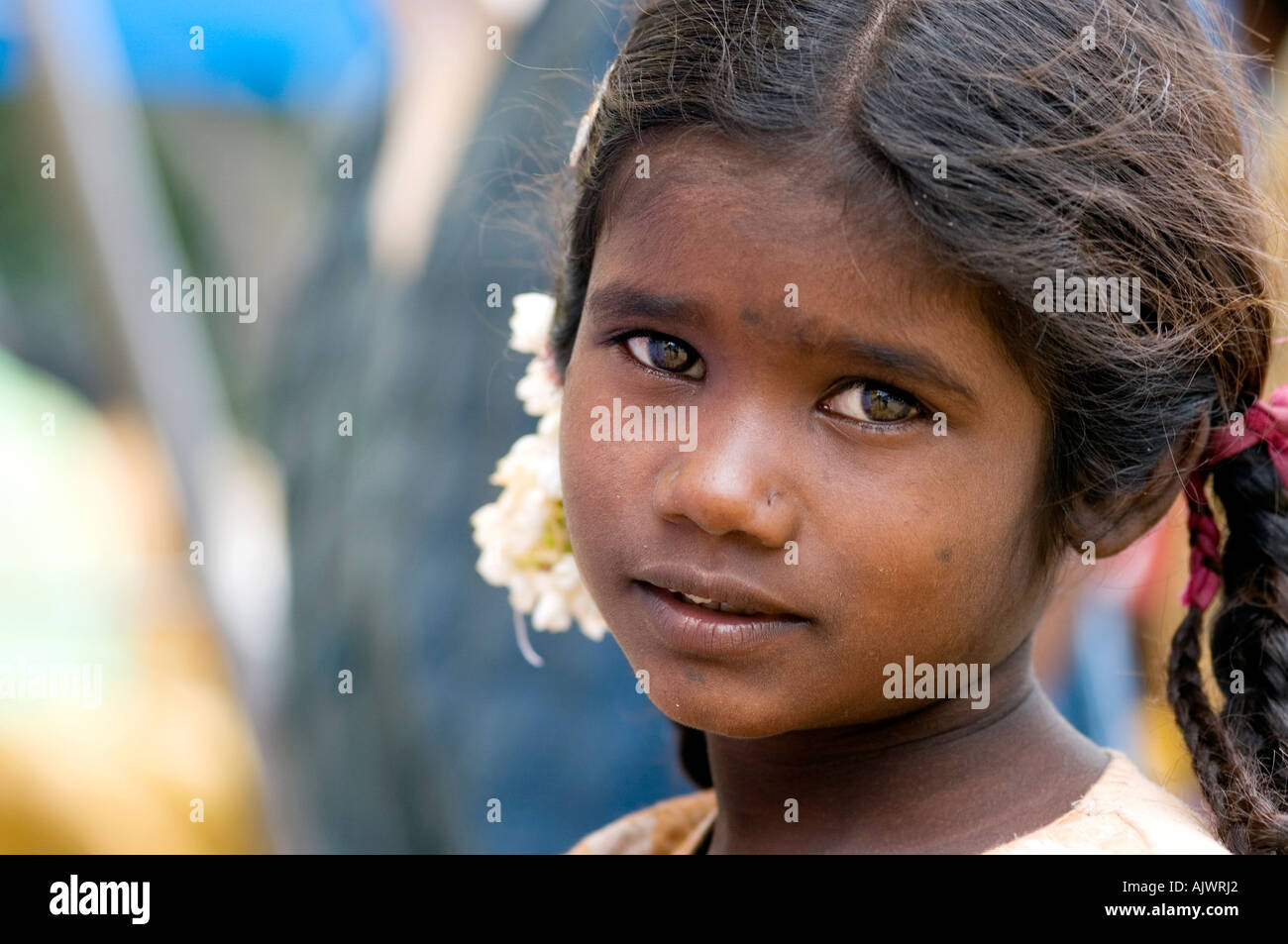 Young poor Southern Indian street girl looking at the camera Stock ...