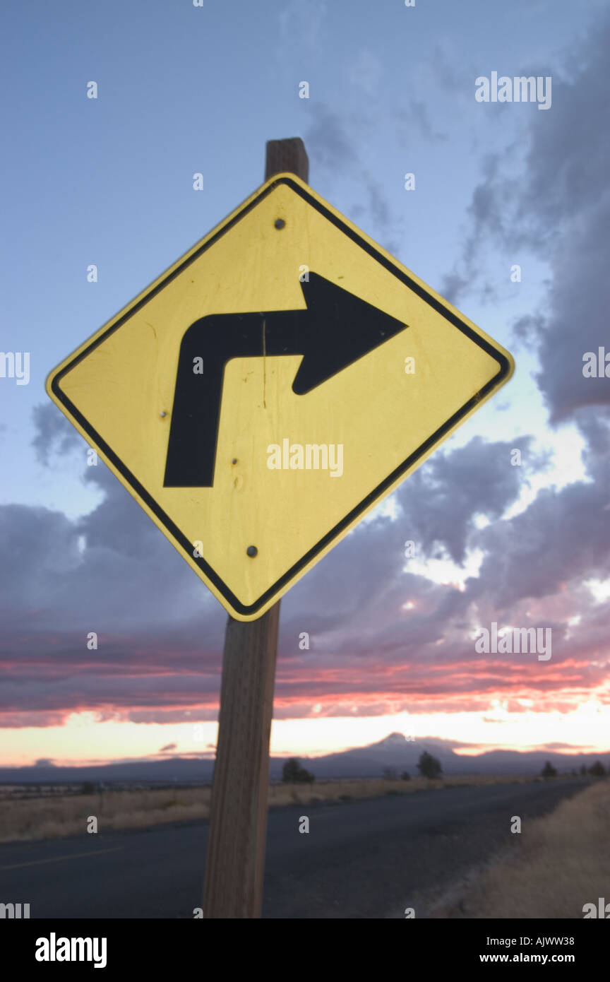 Road sign indicating curve in road Stock Photo - Alamy