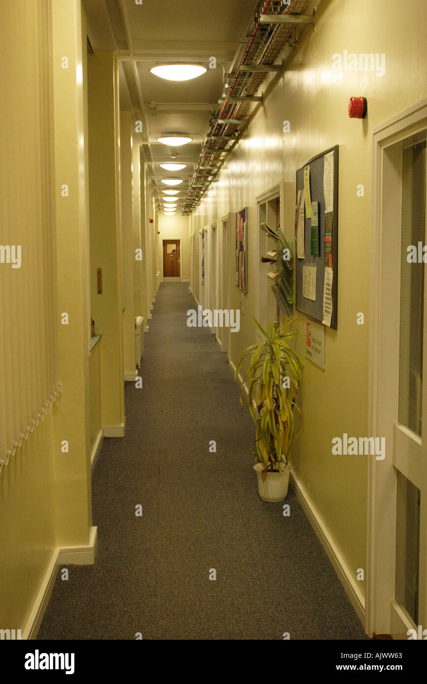 Long narrow corridor in public building Stock Photo - Alamy