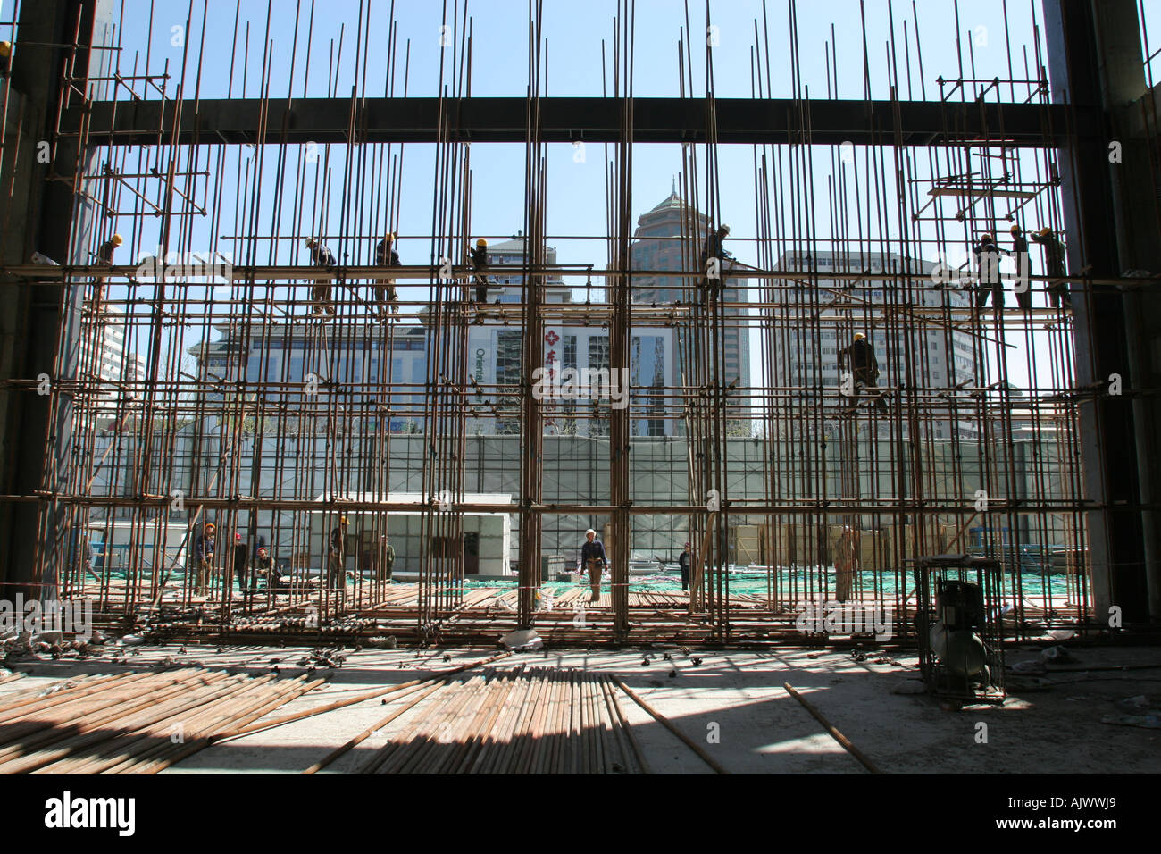 Construction workers build a curtain wall at the CYTS project in ...