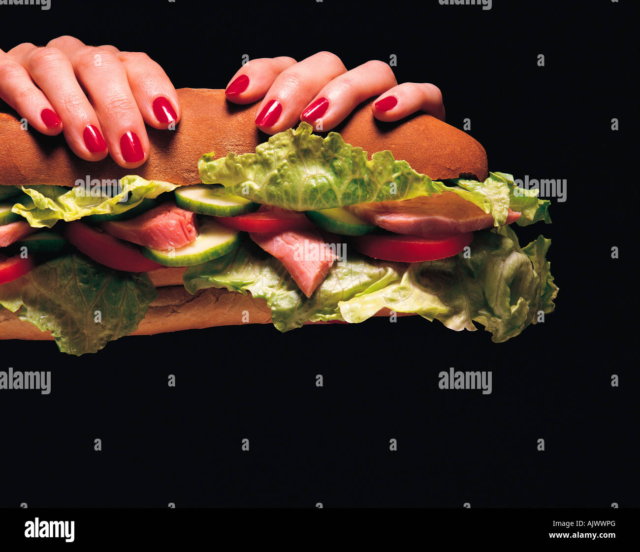 Hand holding ham sandwich bread hi-res stock photography and images - Alamy