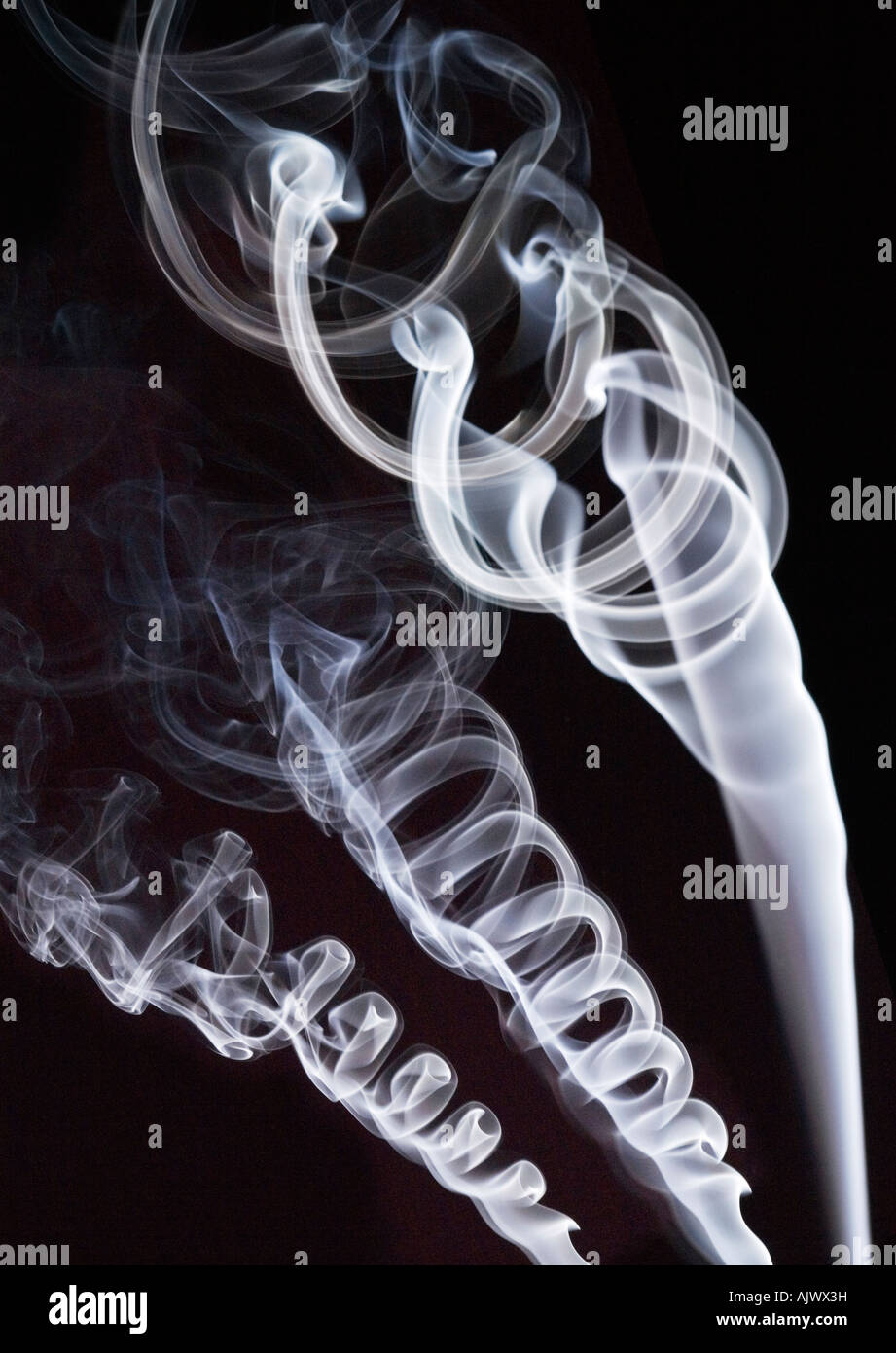 Smoke from burning incense sticks Stock Photo - Alamy