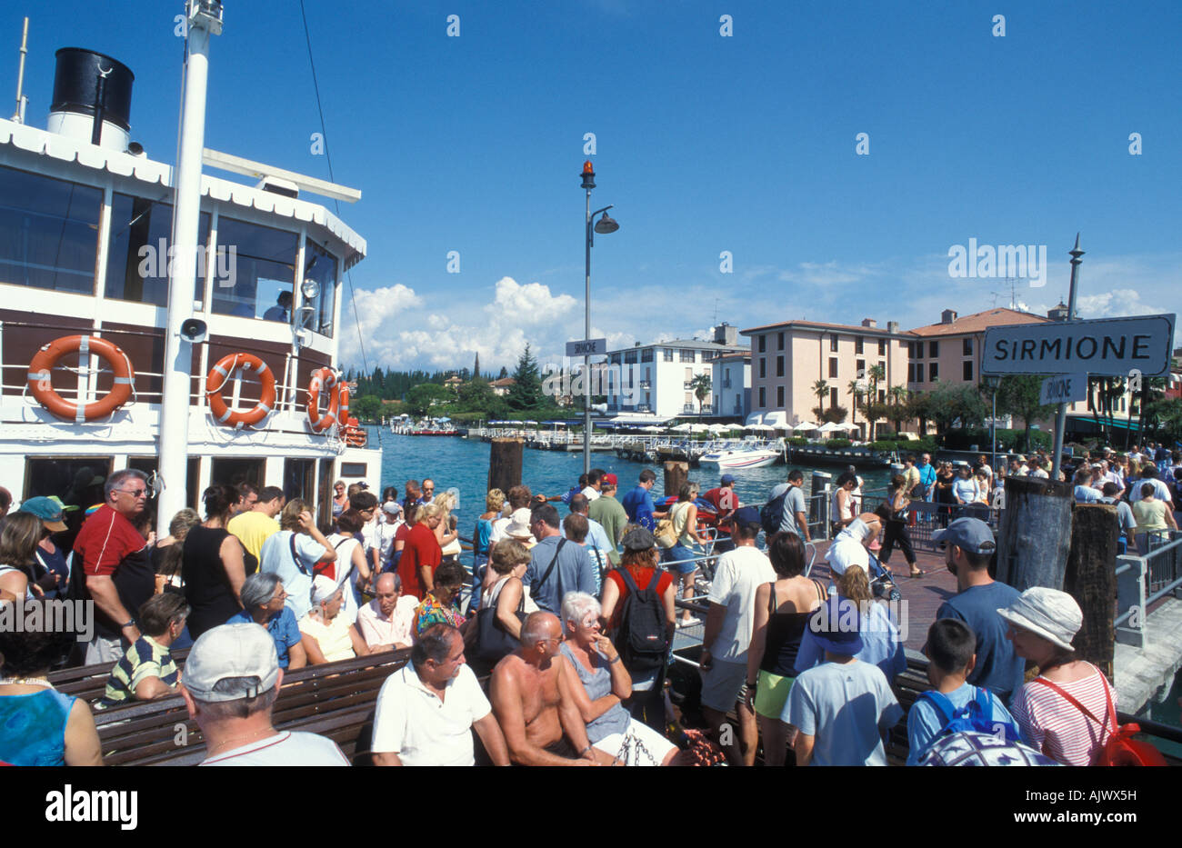 Foot passenger ferry at the landing stage in Sirmione Garda Lake Italy ...