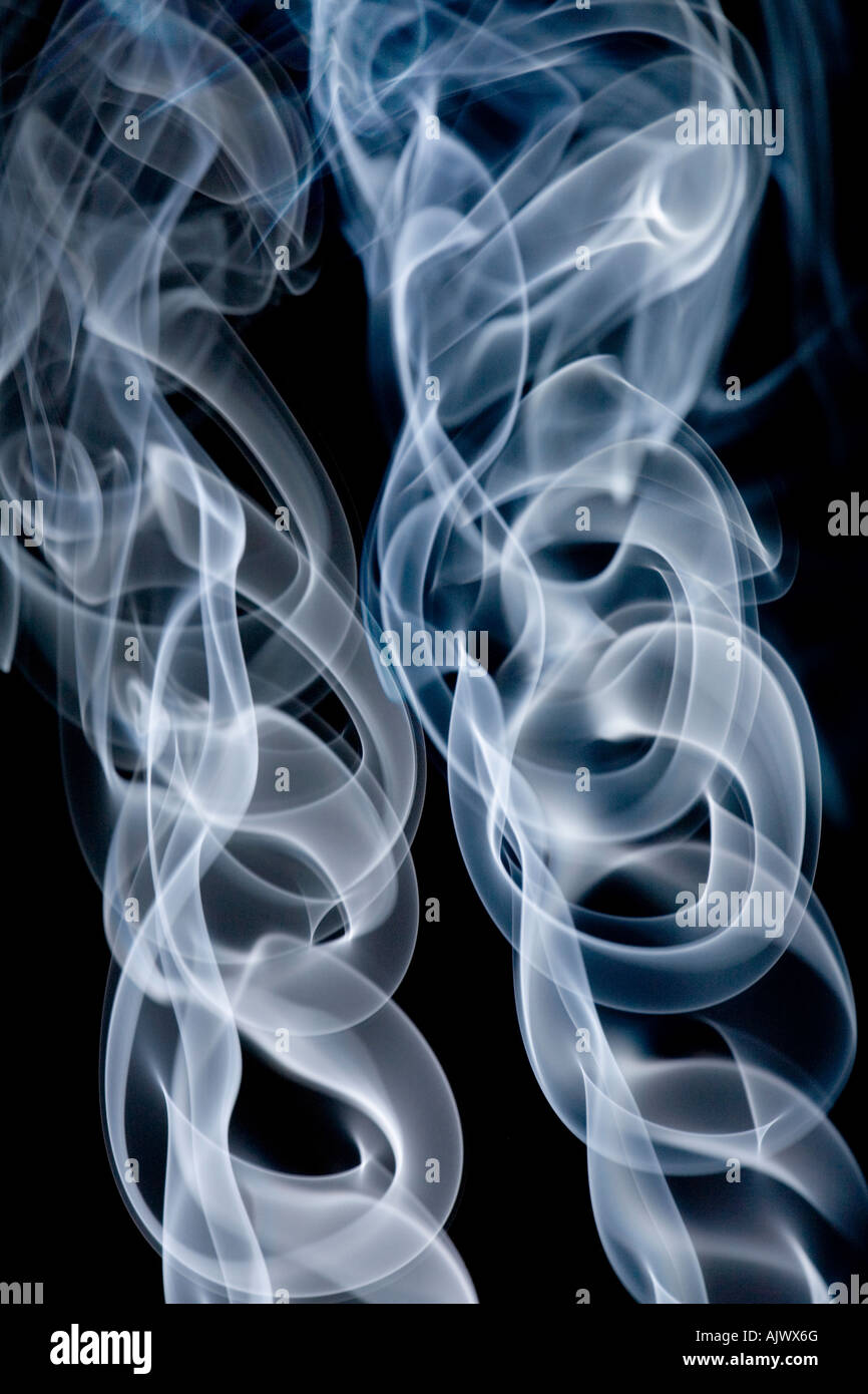 Smoke from burning incense sticks Stock Photo - Alamy