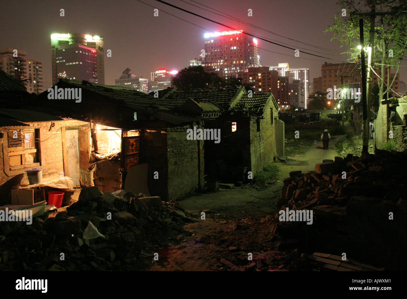 Residents still living in a hutong or alleyway being gradually cleared ...