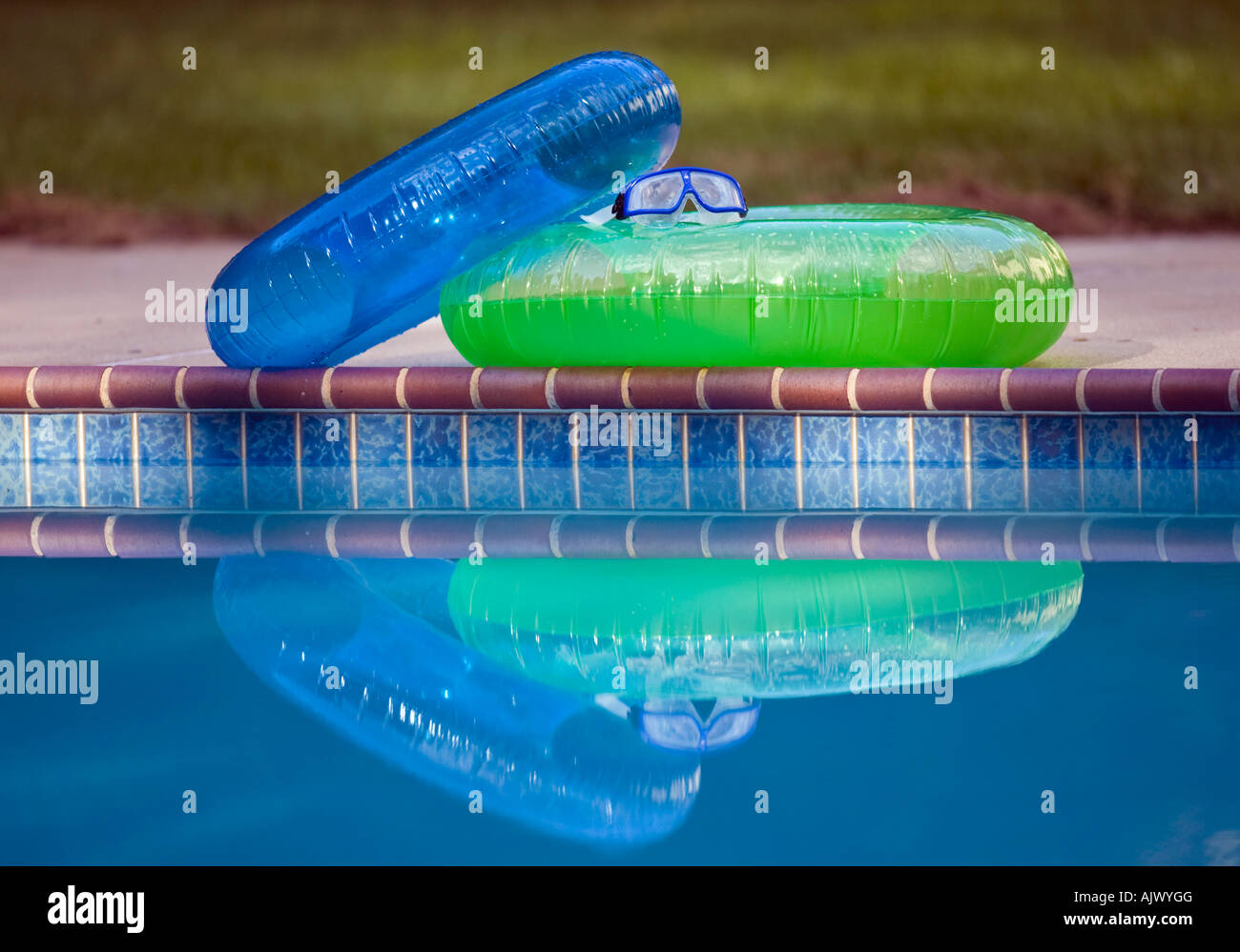 Floats by the side of a pool Stock Photo - Alamy
