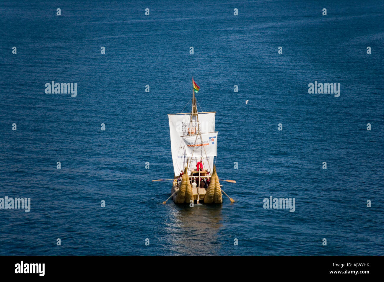 Sail boat arriving at the Isla del Sol, the Island of the Sun on Lake ...